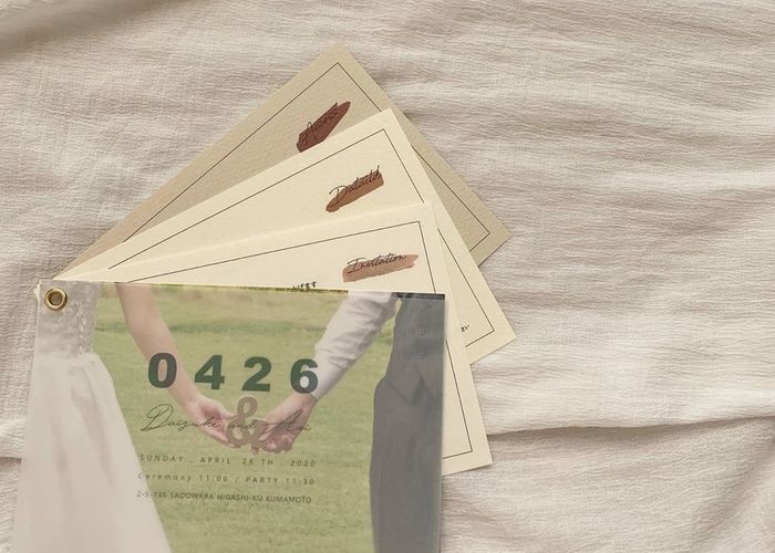Trendy Wedding Invitations: Stylishly Fastened with Eyelets | marry